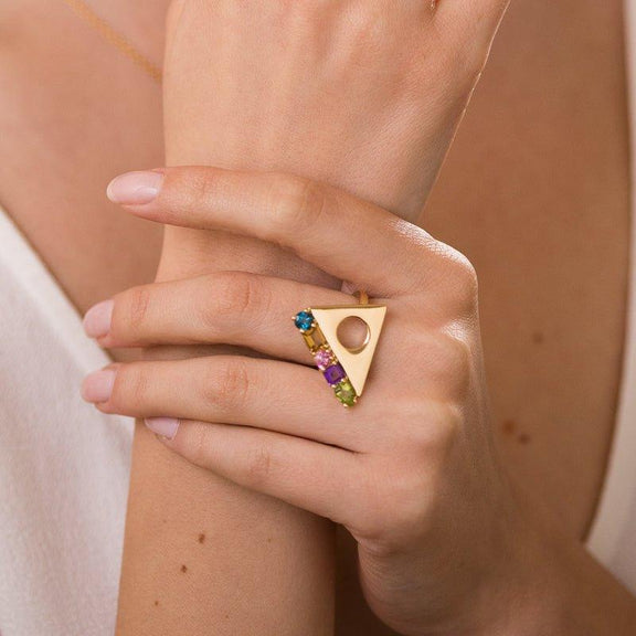 LÚDERE gold triangle ring with peridot, amethyst, pink topaz, cognac quartz, and London blue ...