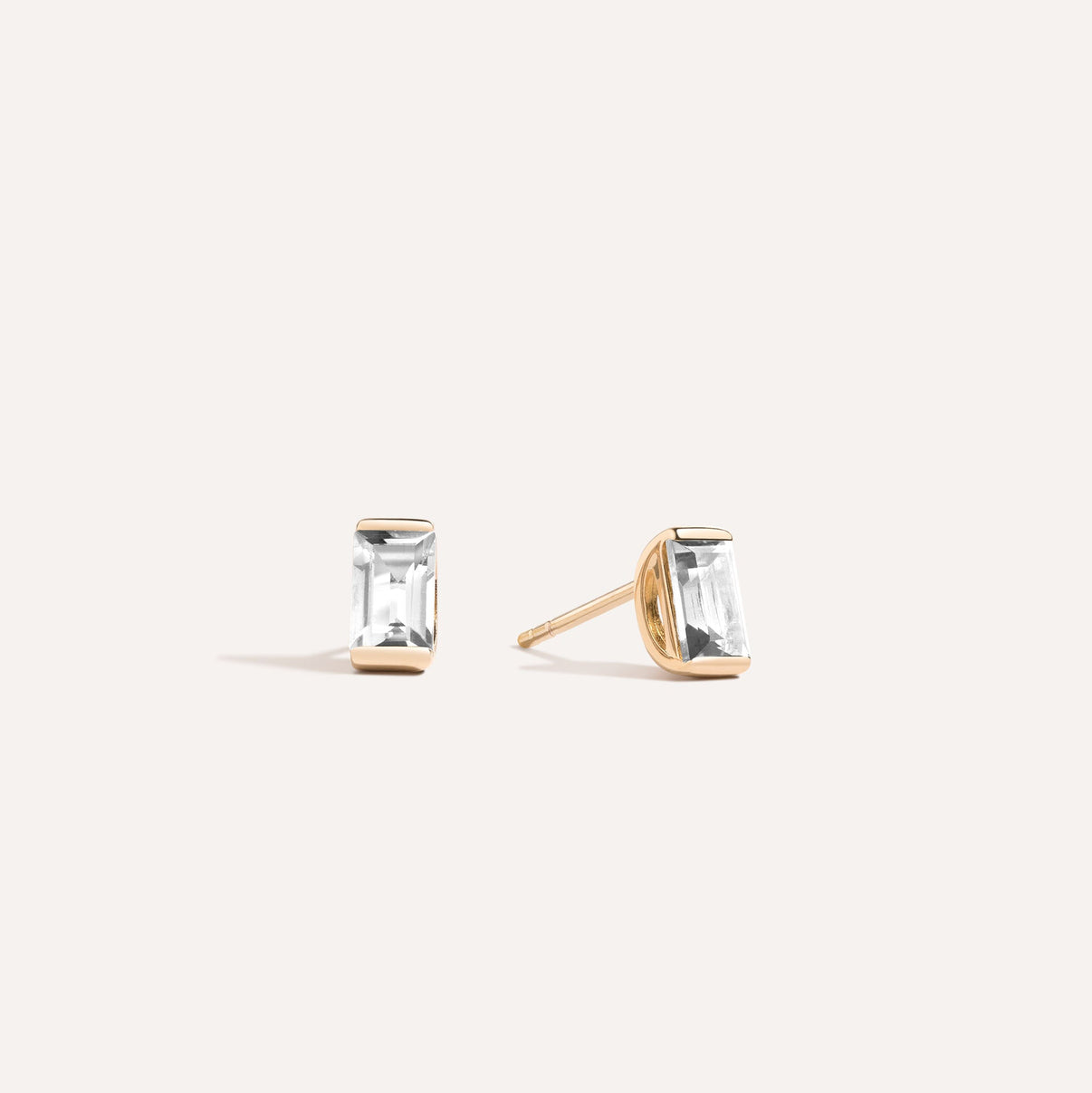 LÚDERE white topaz baguette gemstone stud earrings in gold